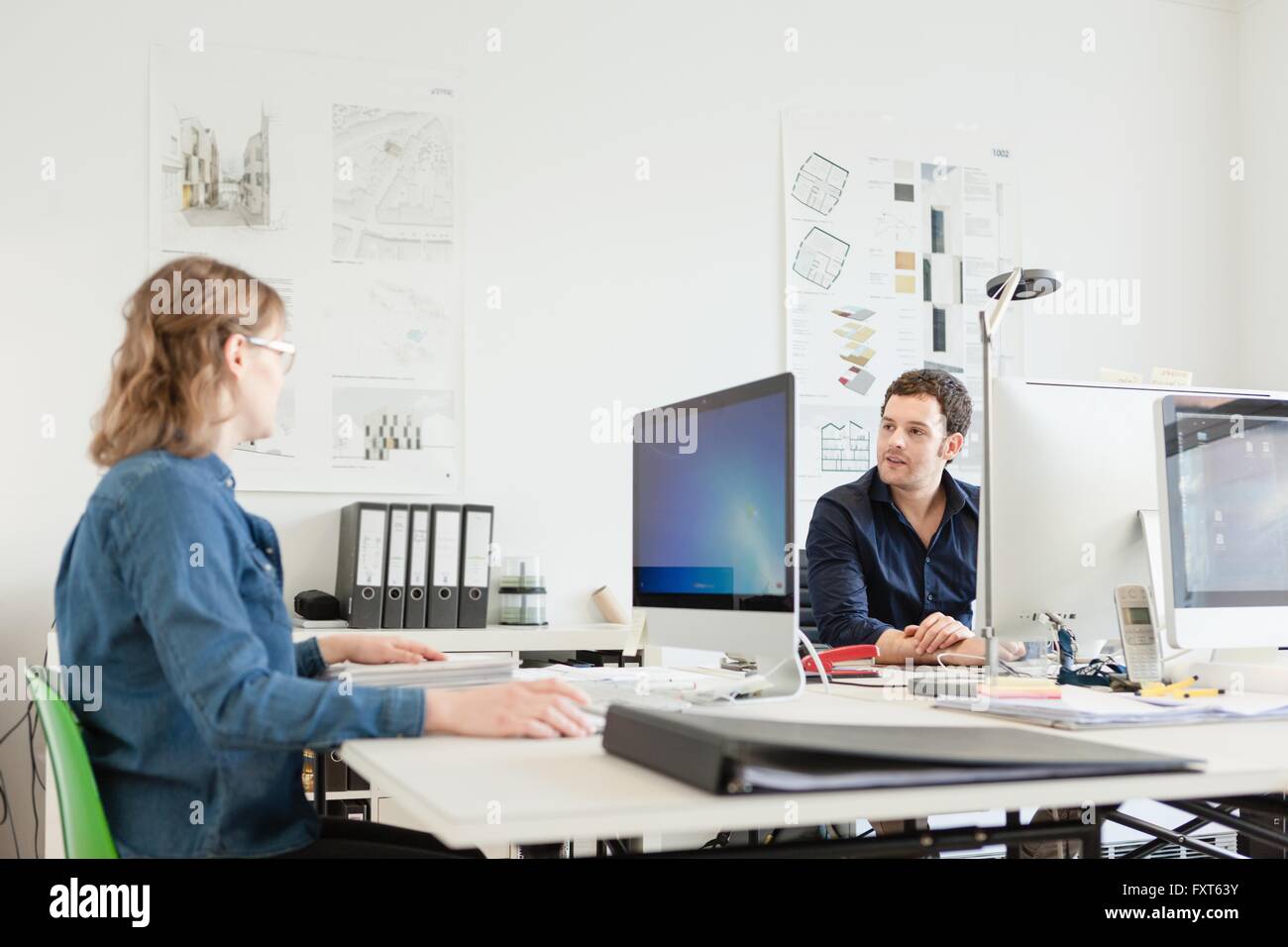 People sitting computers working office hi-res stock photography and ...