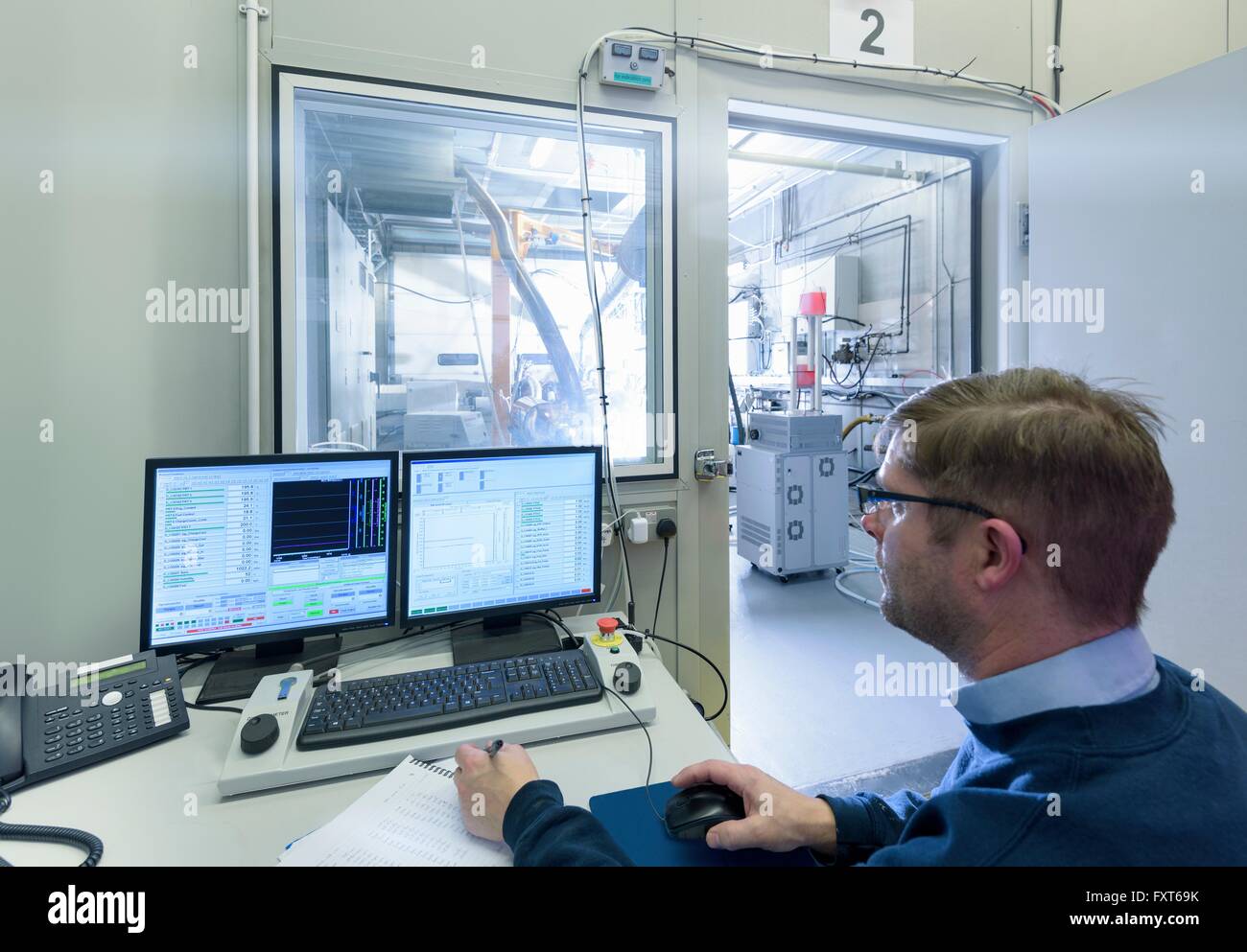 Man in control room monitoring hi-res stock photography and images - Alamy