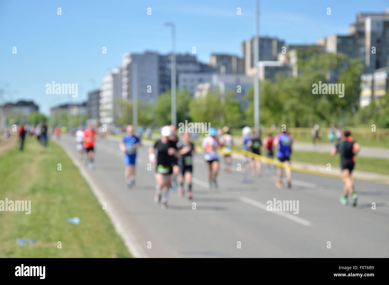 Blurred (unfocused) image of runners on the international city race ...