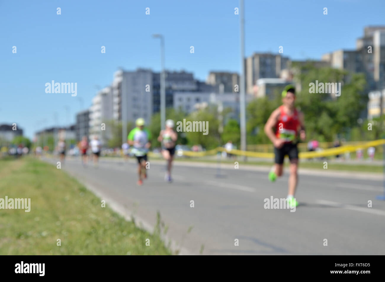 Blurred (unfocused) image of runners on the international city race ...