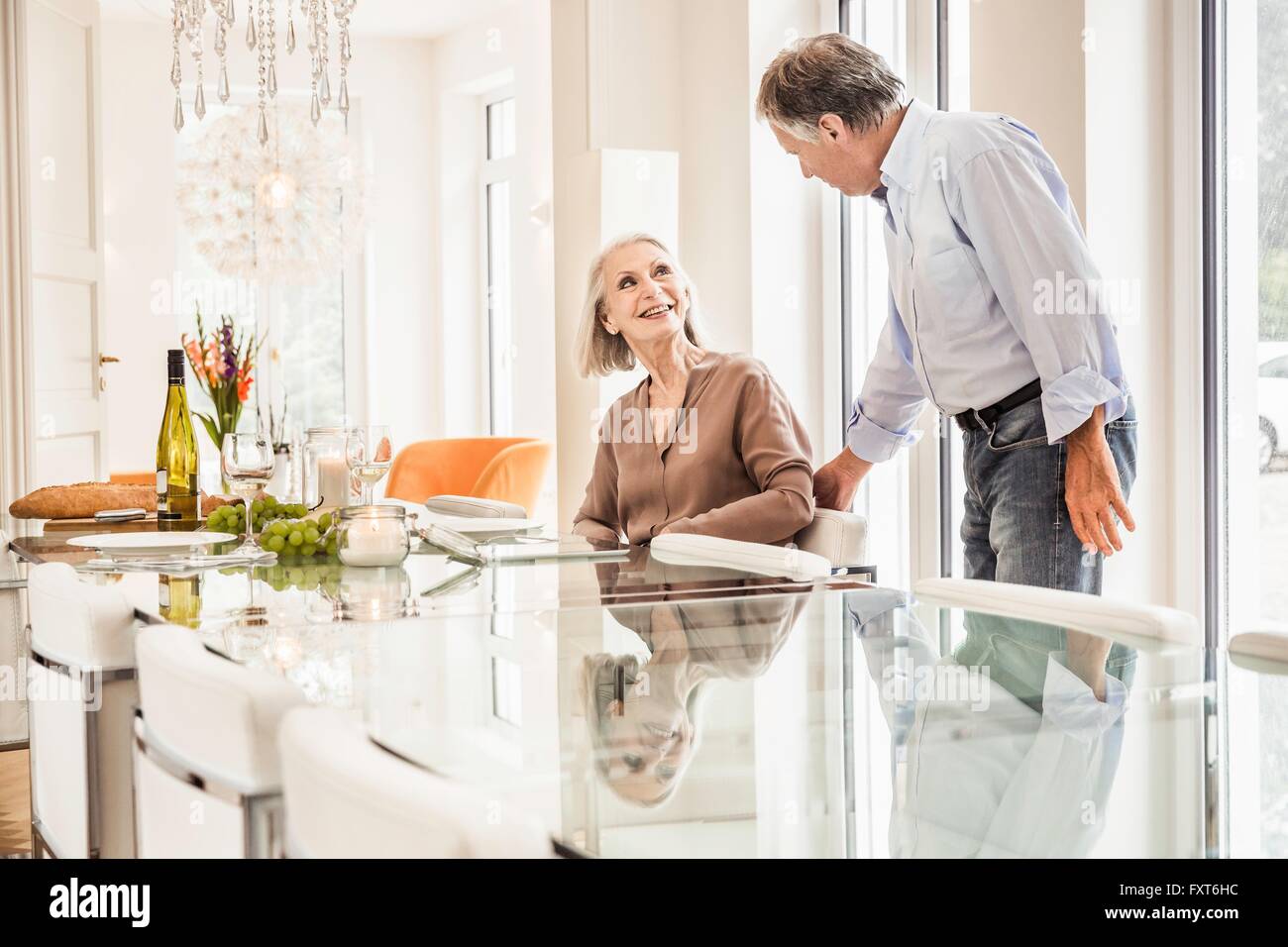 Standing beside table hi-res stock photography and images - Alamy