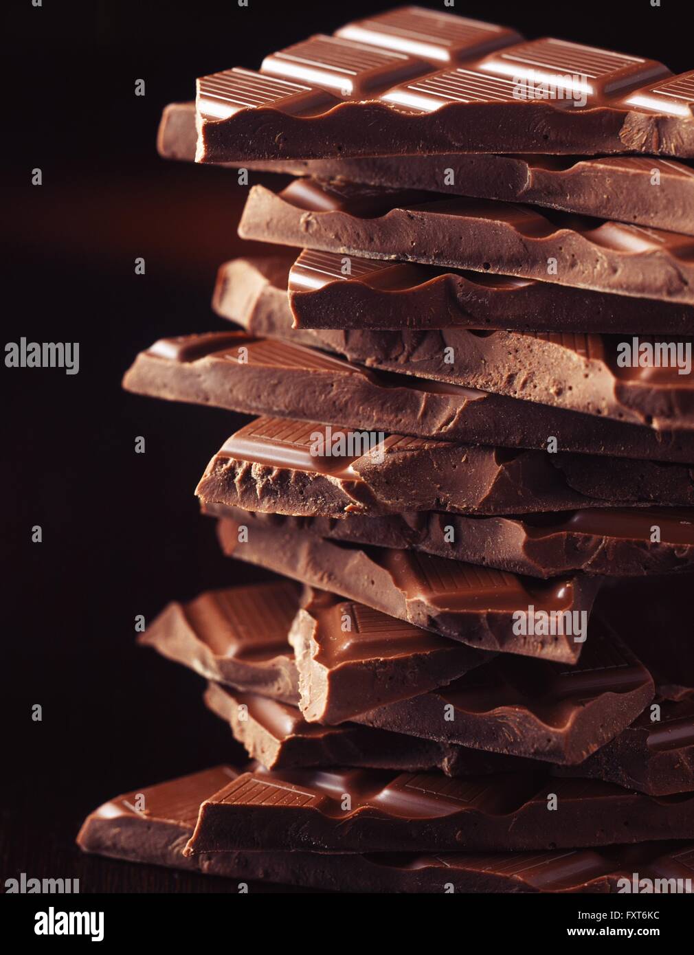 Stack of broken chocolate bars, close-up Stock Photo - Alamy