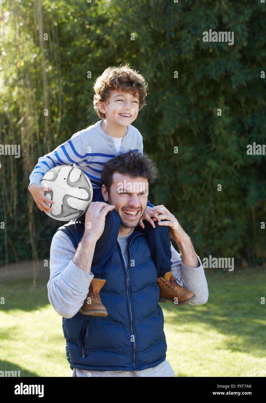 Close up young man carrying football hi-res stock photography and ...
