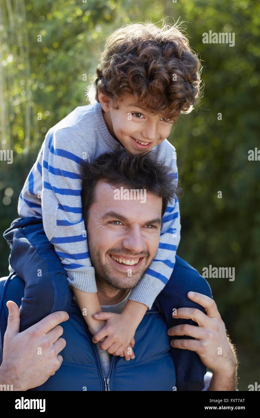 Father carrying son on shoulder hi-res stock photography and images - Alamy
