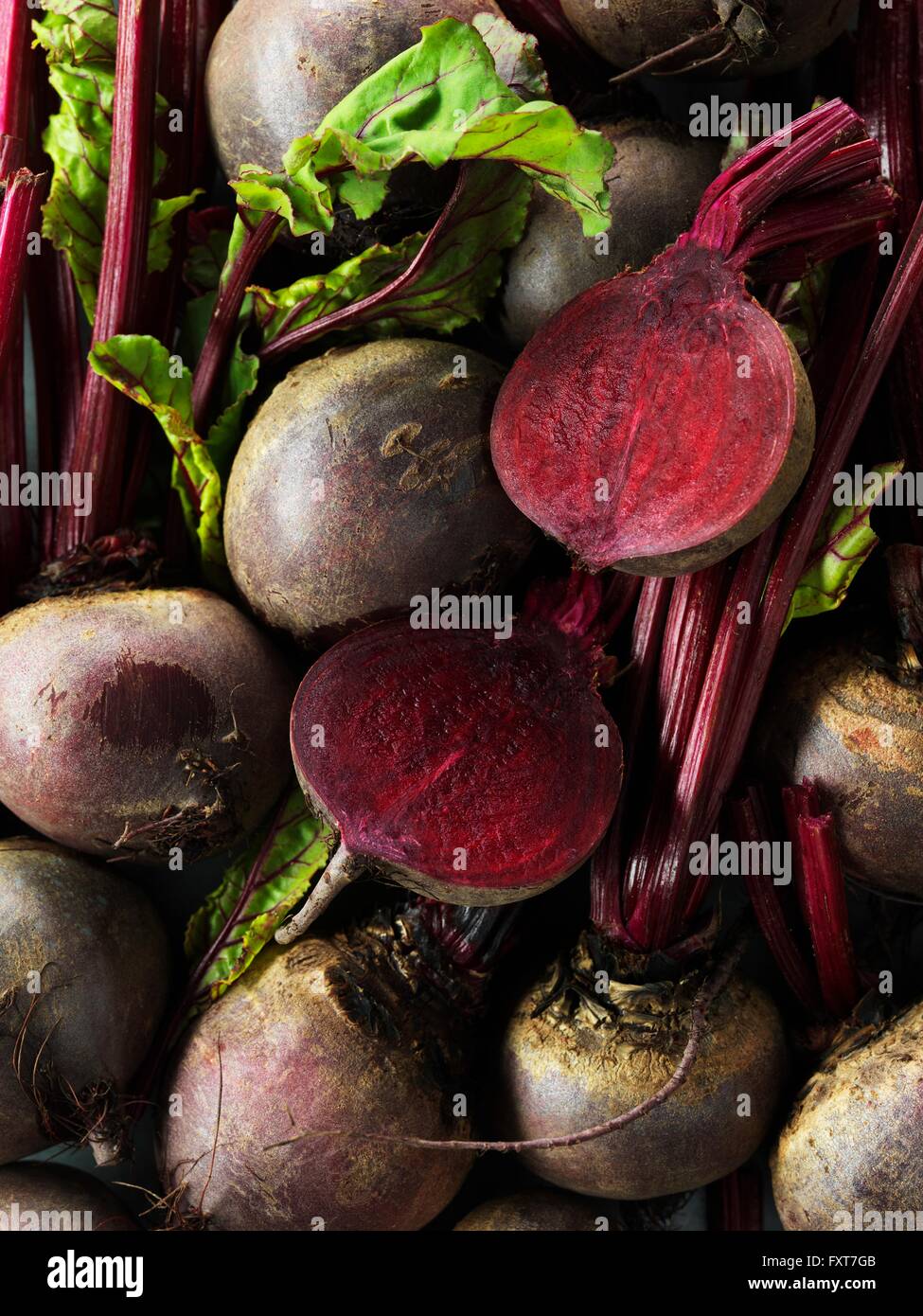 Raw beetroot, whole and sliced in half Stock Photo - Alamy