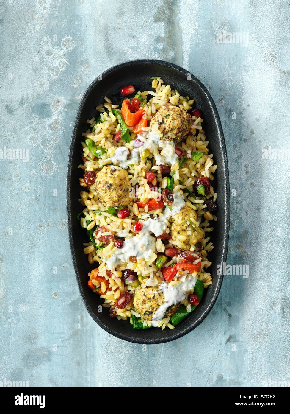 Persian lamb chicken kaftan, red peppers, pomegranate, rice, coriander ...