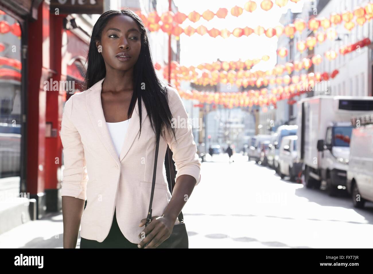 Woman walking away street hi-res stock photography and images - Alamy