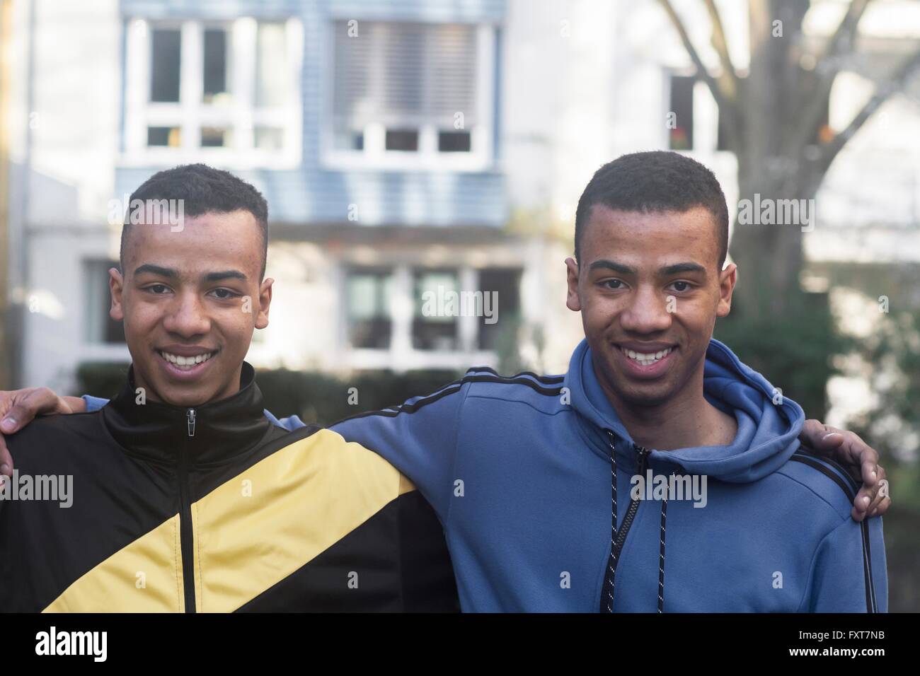 Smiling brothers arm around hi-res stock photography and images - Alamy