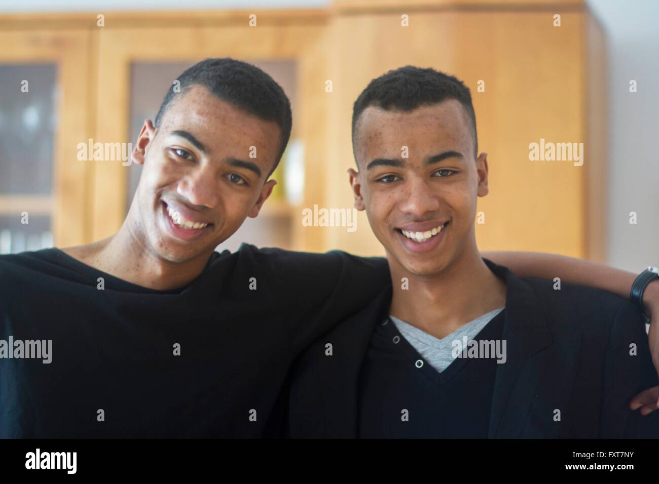 Smiling brothers arm around hi-res stock photography and images - Alamy