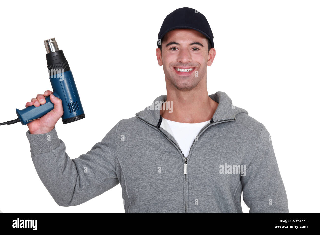 Man with a heat gun Stock Photo - Alamy