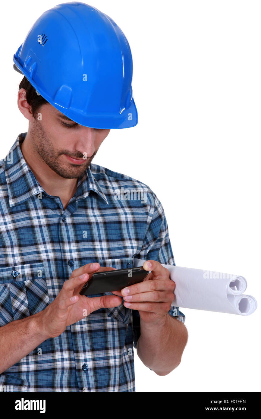 Architect sending text message Stock Photo - Alamy