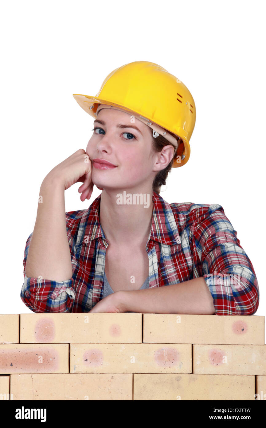 Pensive female construction worker Stock Photo - Alamy