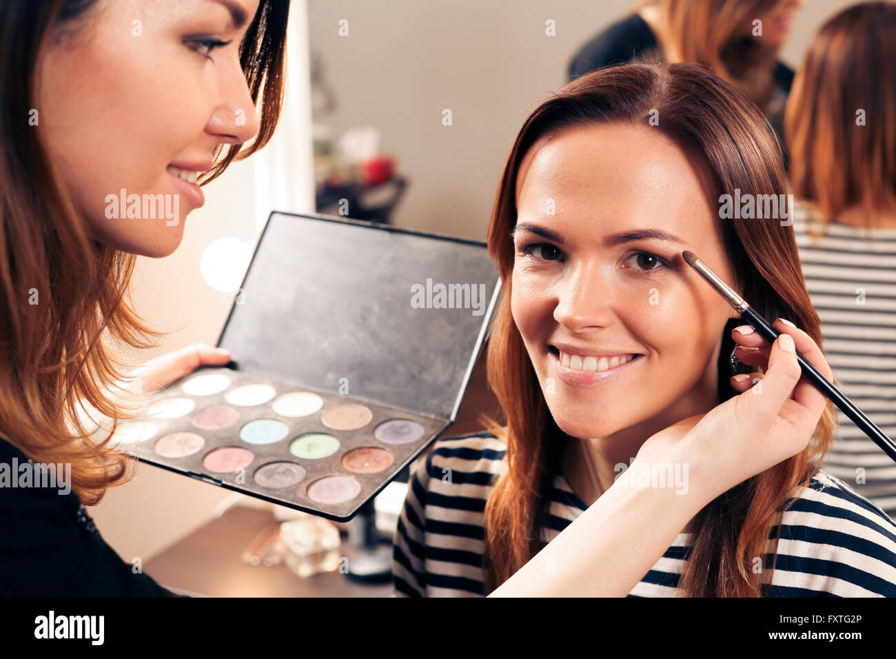 Makeup artist in beauty salon hi-res stock photography and images - Alamy