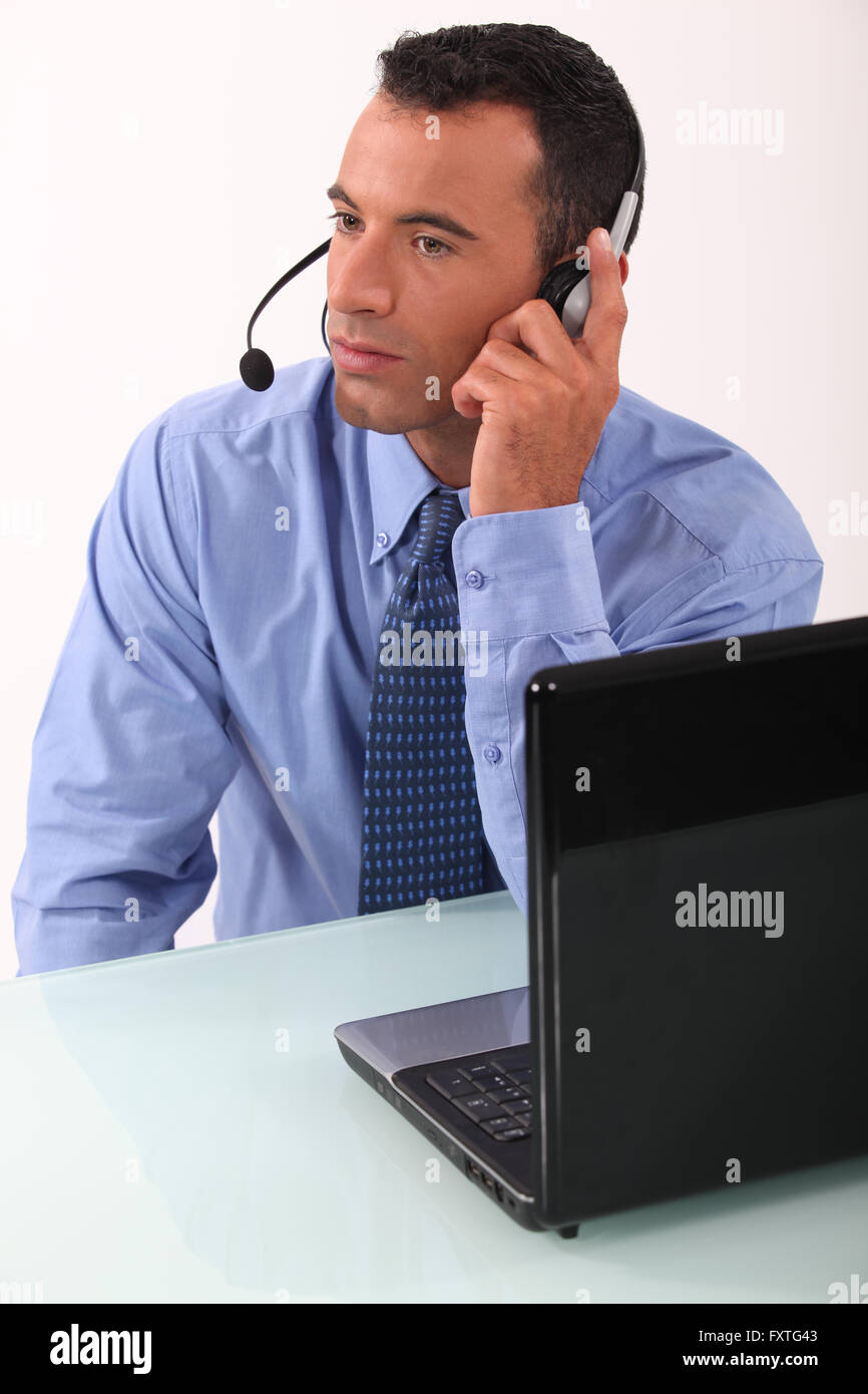 Executive with headphones and microphone Stock Photo - Alamy
