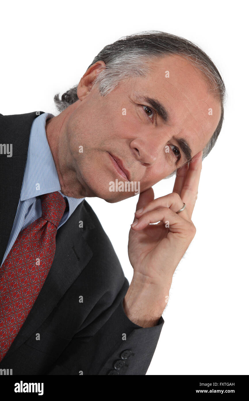 Businessman thinking alone Stock Photo - Alamy
