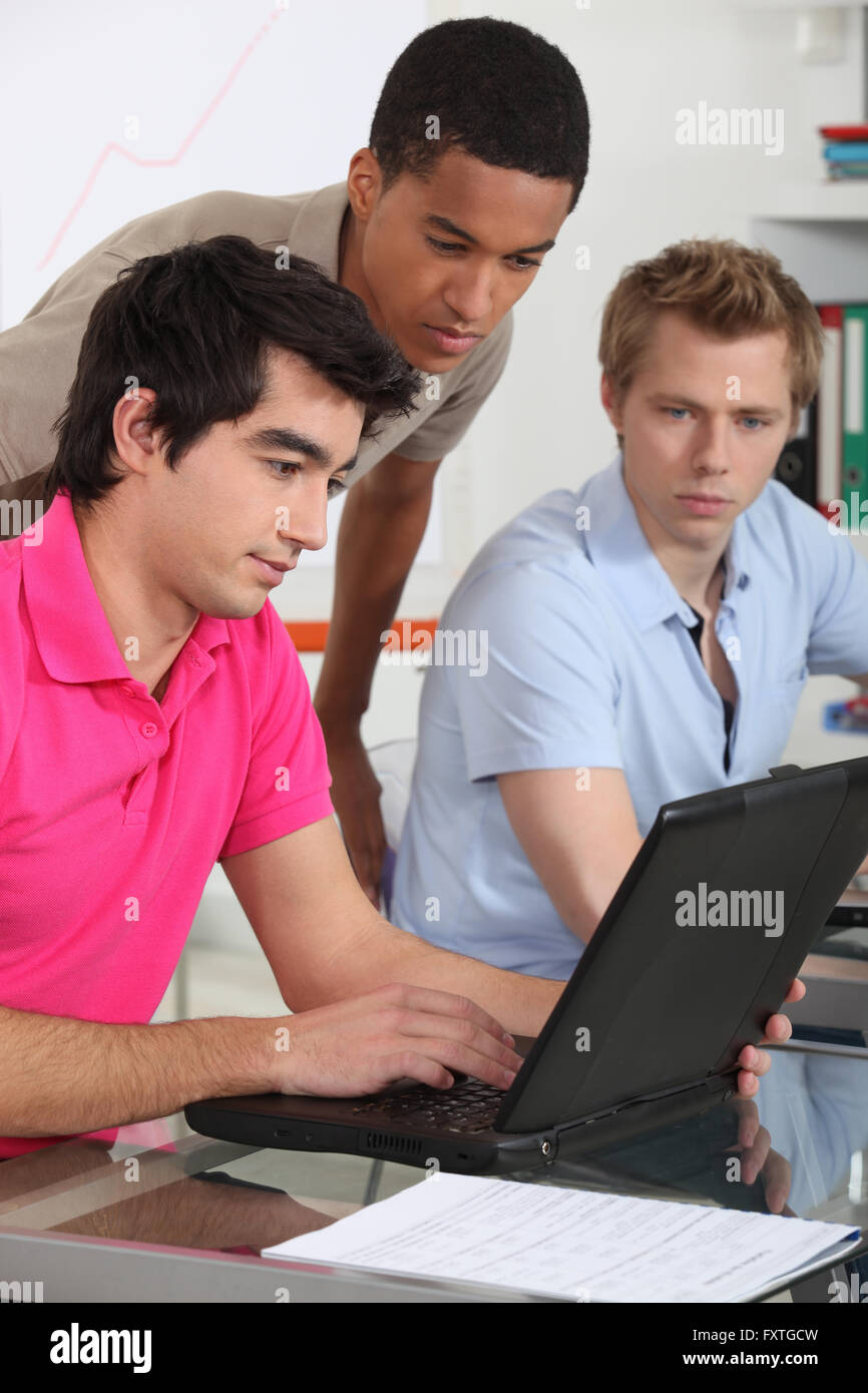 Three male students revising together Stock Photo - Alamy
