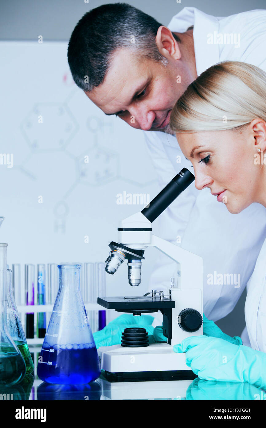 two scientist in chemical lab conducting experiments Stock Photo - Alamy