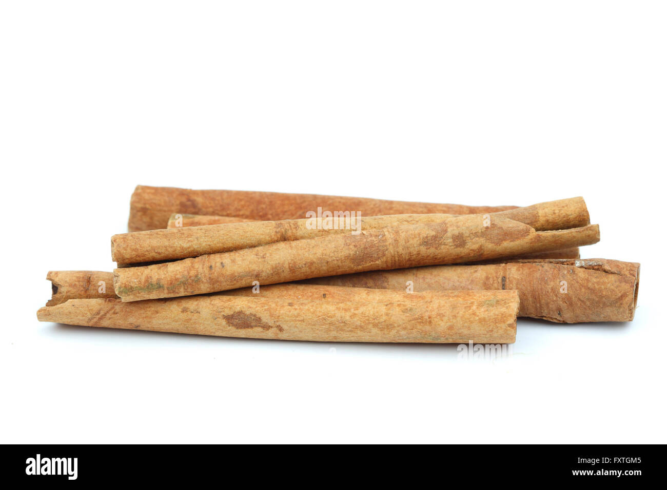 cinnamon pile isolated on white Stock Photo - Alamy