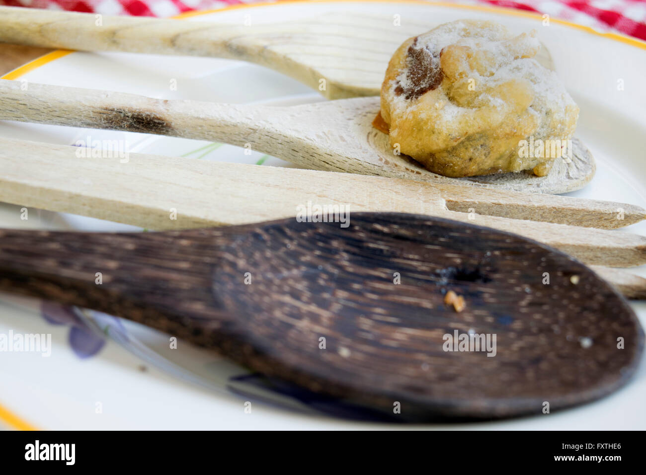 chocolate cream puff with icing sugare on wooden spoon Stock Photo - Alamy