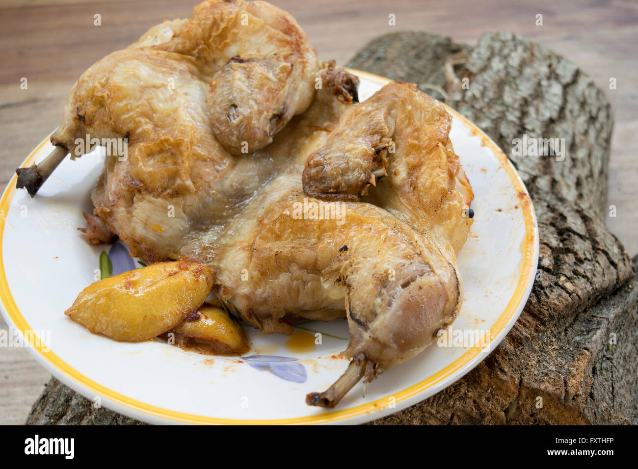 devilled chicken cooked in wooden oven and served on wooden stump Stock ...