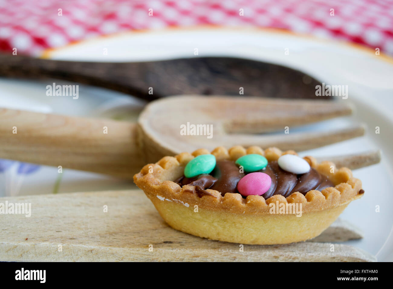 pastry with chocolate cream and colored sugared almonds Stock Photo - Alamy