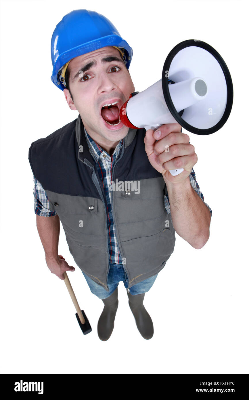 Builder with megaphone Stock Photo - Alamy