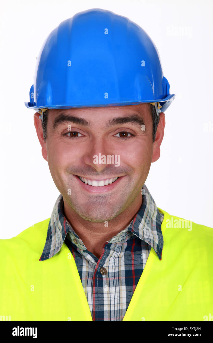 Cheering construction worker Stock Photo - Alamy