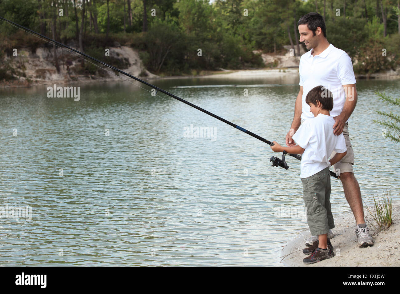Father and son fishing Stock Photo - Alamy