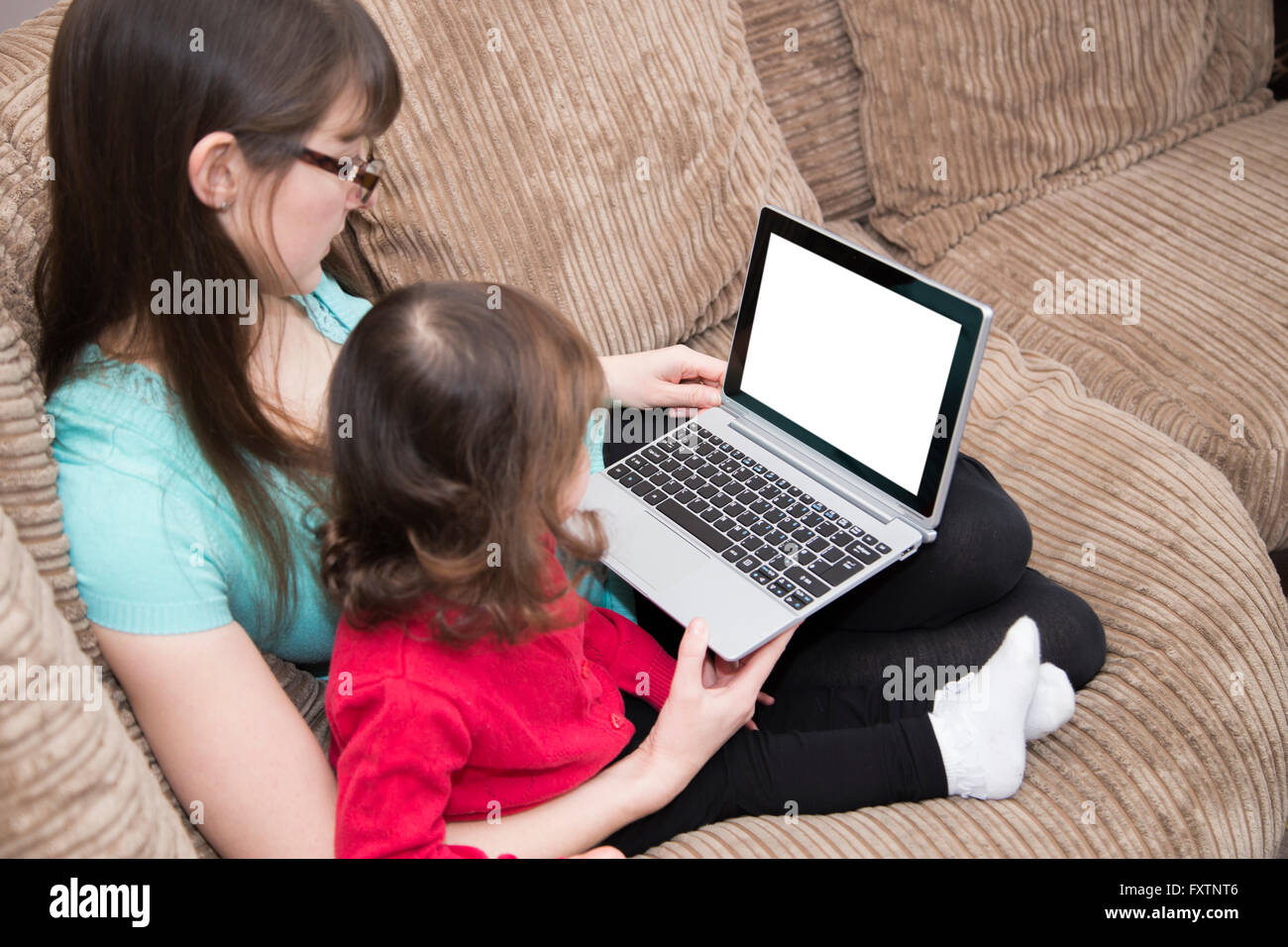 Watching cartoons on laptop Stock Photo - Alamy