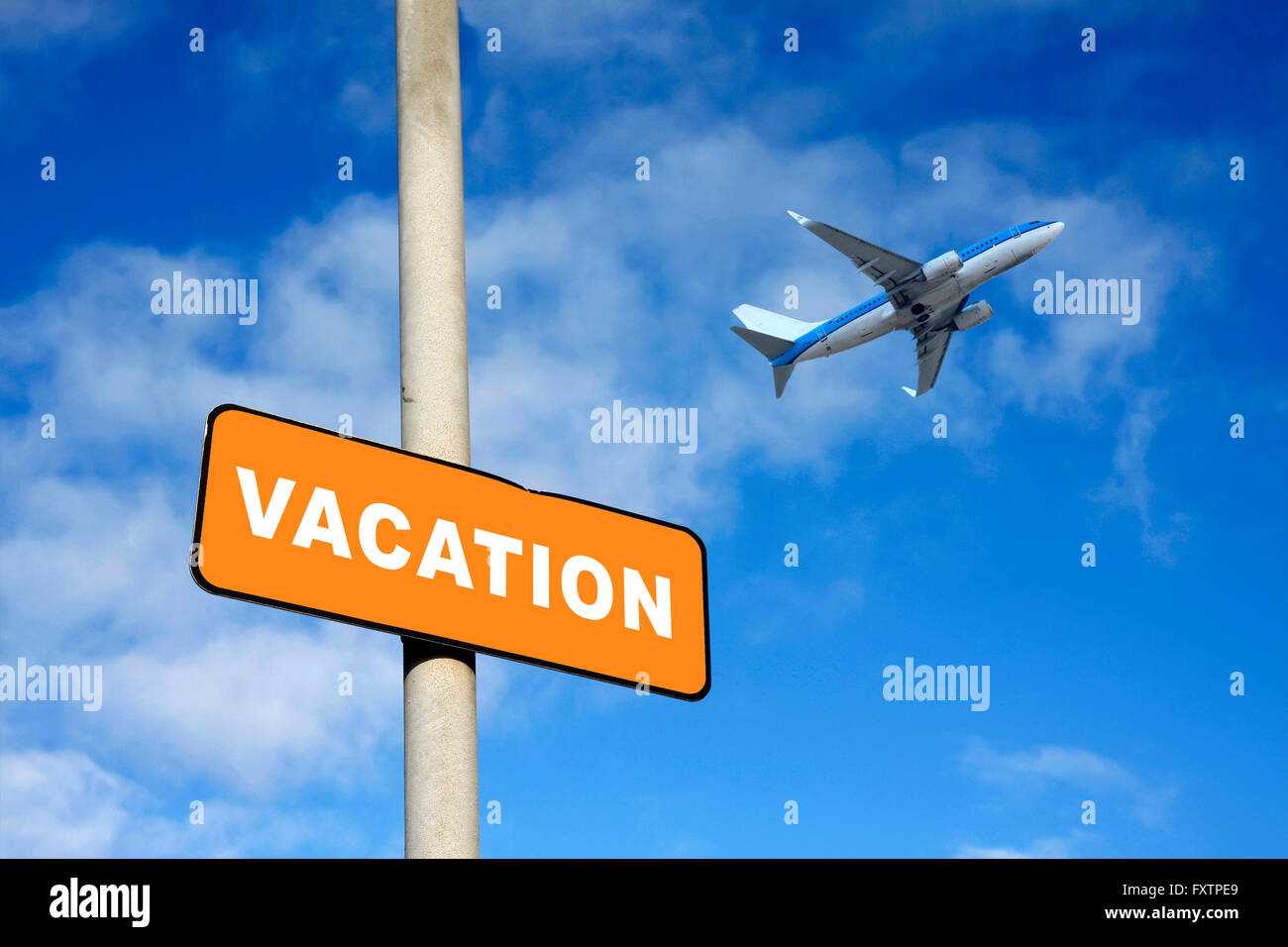 Vacation sign and plane against a blue sky Stock Photo - Alamy