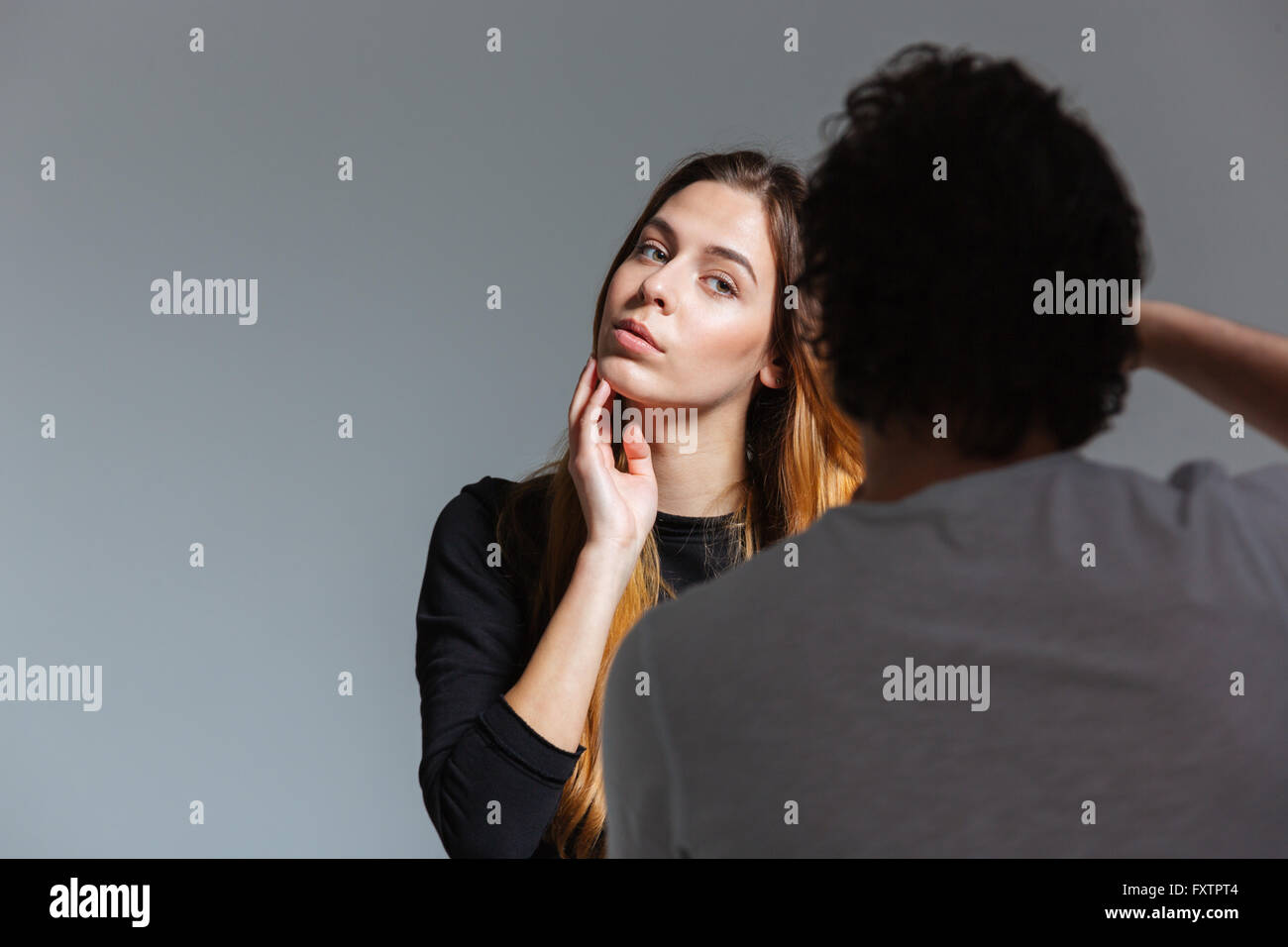 Man photographing female model in studio Stock Photo - Alamy