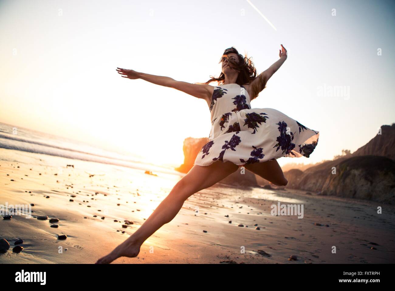 Ballerina dancing on beach Stock Photo - Alamy