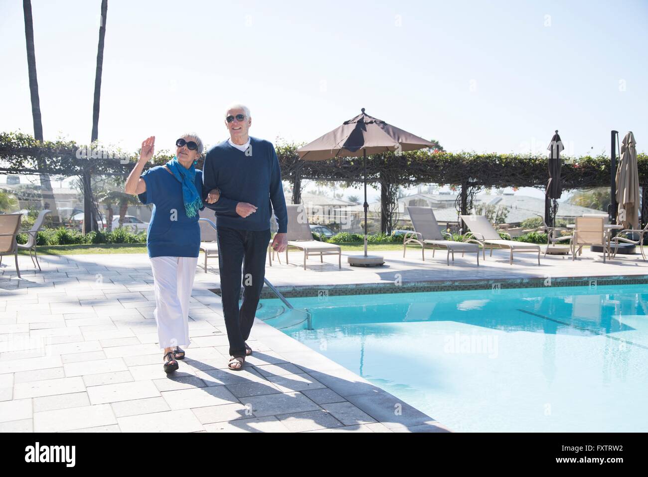 Man walking swimming pool hi-res stock photography and images - Alamy