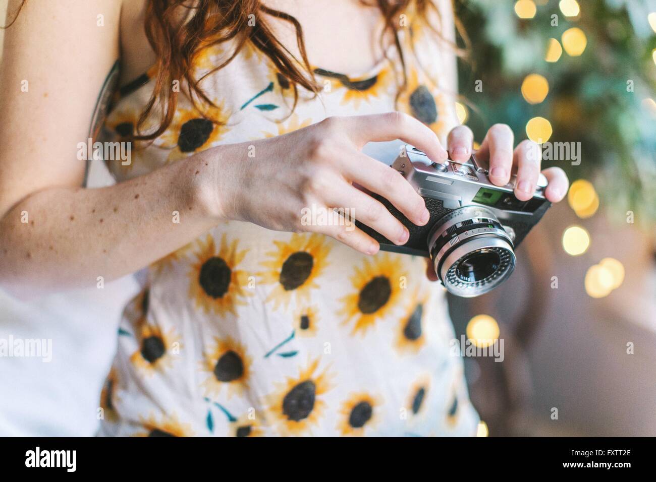 Young woman SLR camera, mid section Stock Photo - Alamy