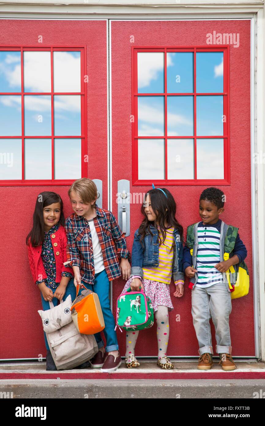 Children outside elementary school on first day of school Stock Photo ...
