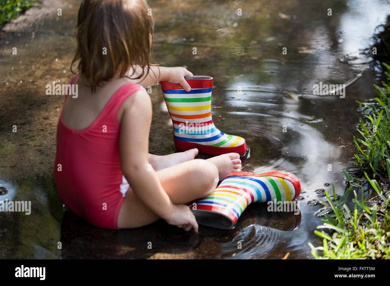 Child in wellies hi-res stock photography and images - Alamy