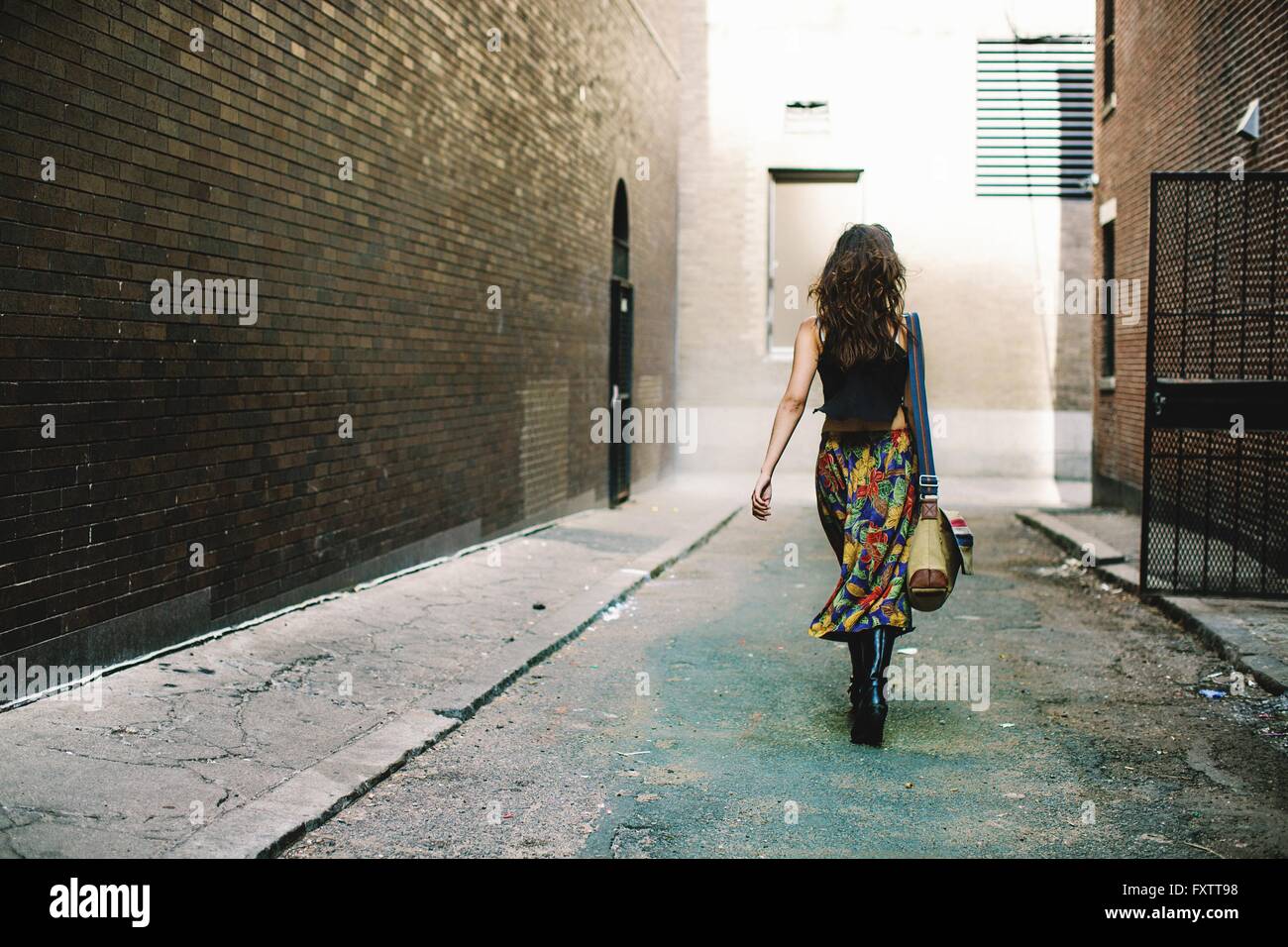 Woman walking rear view urban hi-res stock photography and images - Alamy