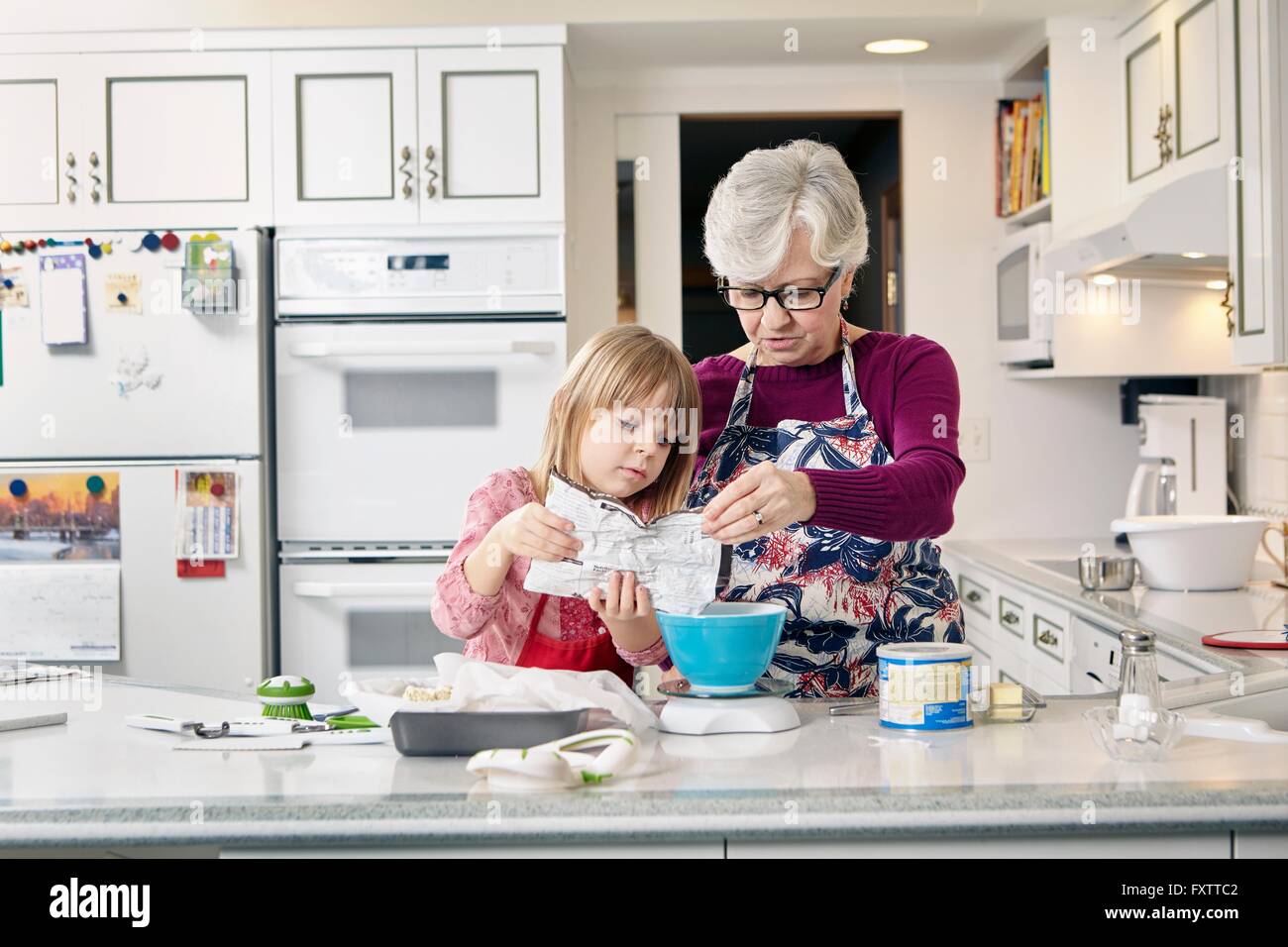 Girl pouring cake mix cake hi-res stock photography and images - Alamy