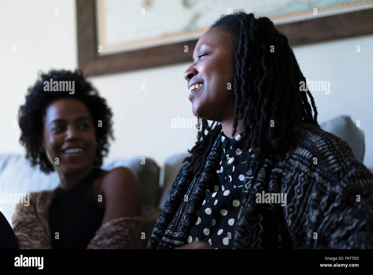 Female friends relaxing at home Stock Photo - Alamy