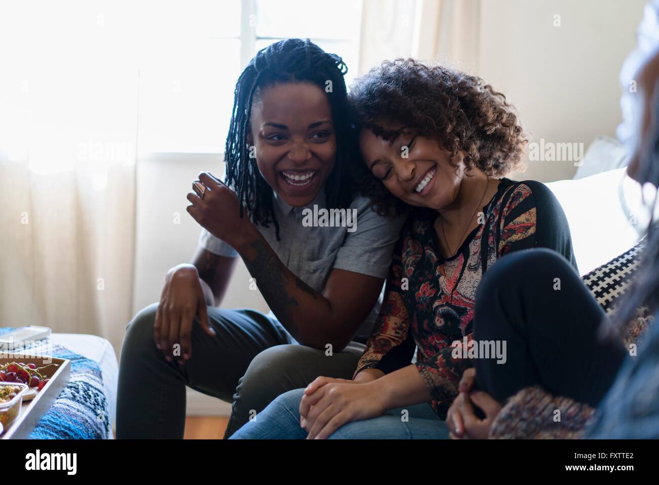 Female friends relaxing at home Stock Photo - Alamy