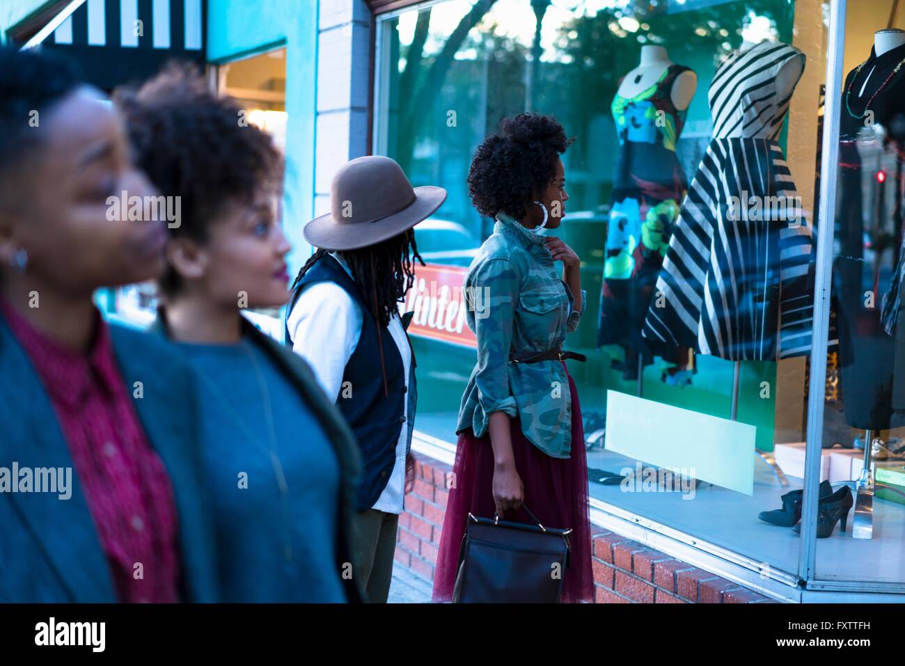 Group of female friends, window shopping Stock Photo - Alamy
