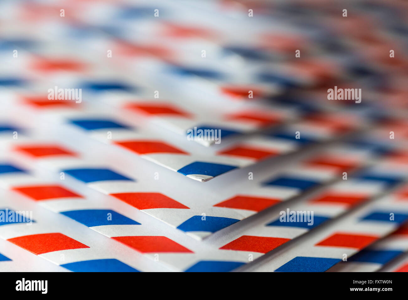 Distinct patterns of red, white and blue of stacked air mail envelopes ...