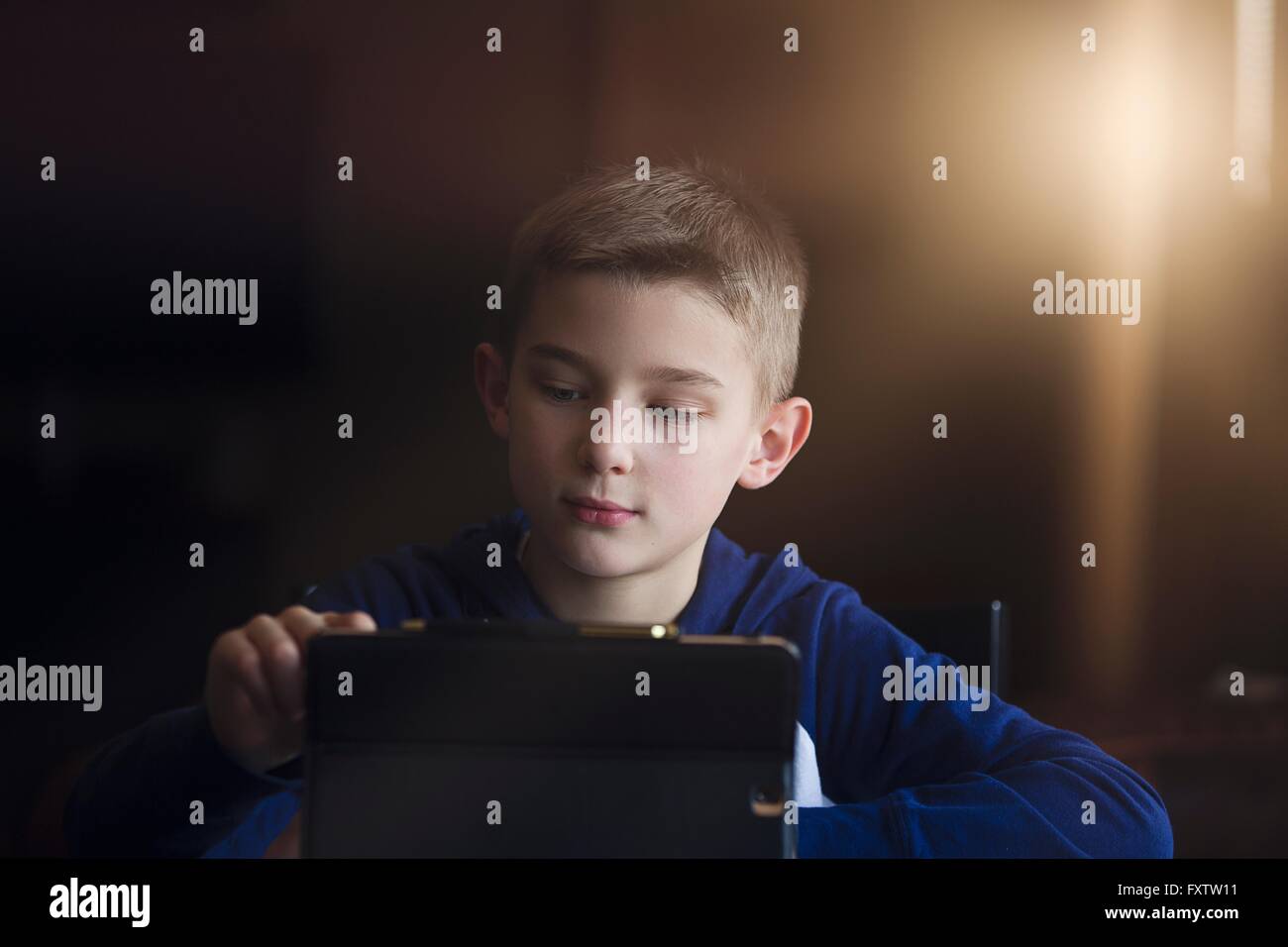 Boy wearing using digital tablet hi-res stock photography and images ...