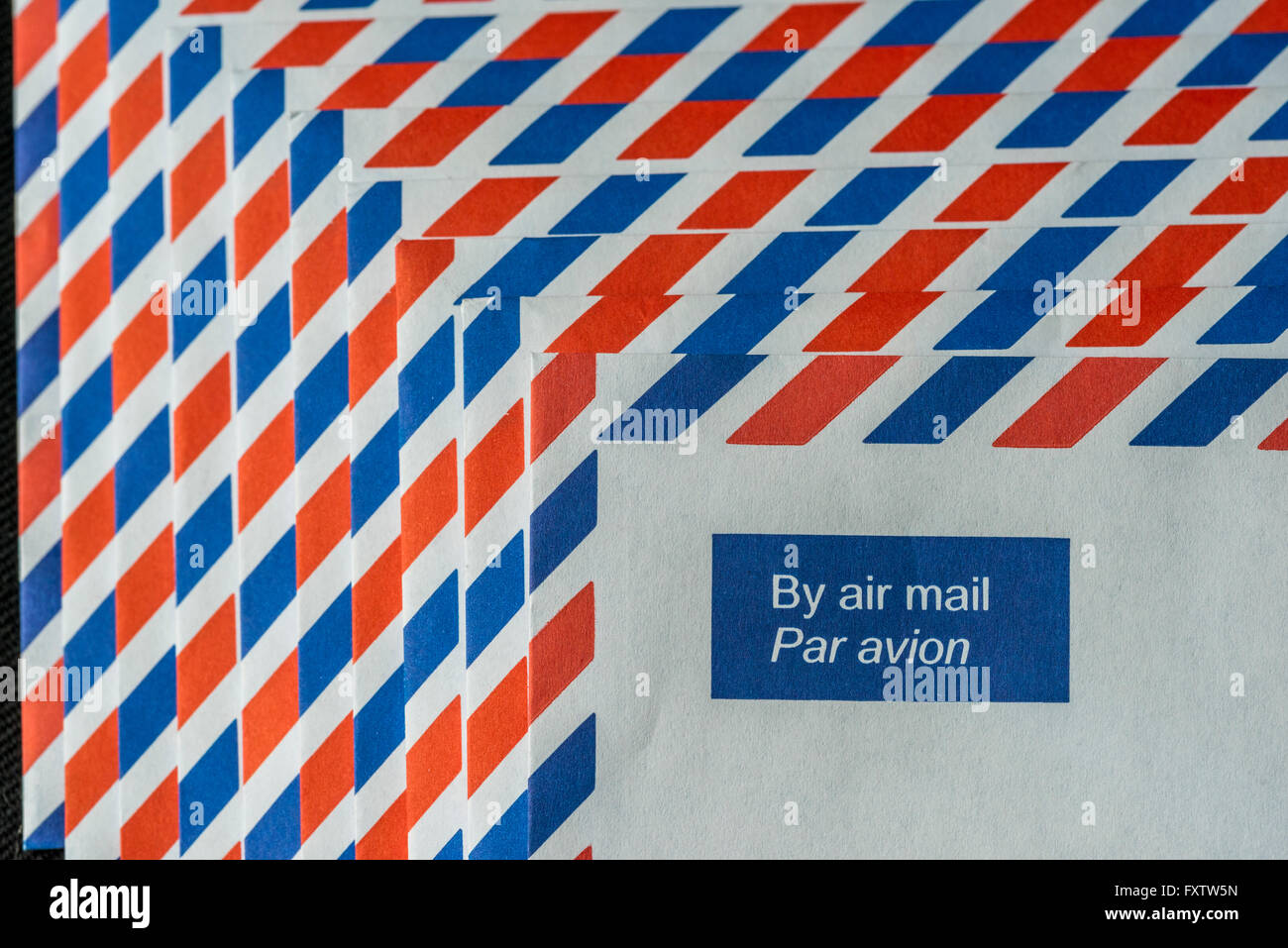 Distinct patterns of red, white and blue of stacked air mail envelopes ...