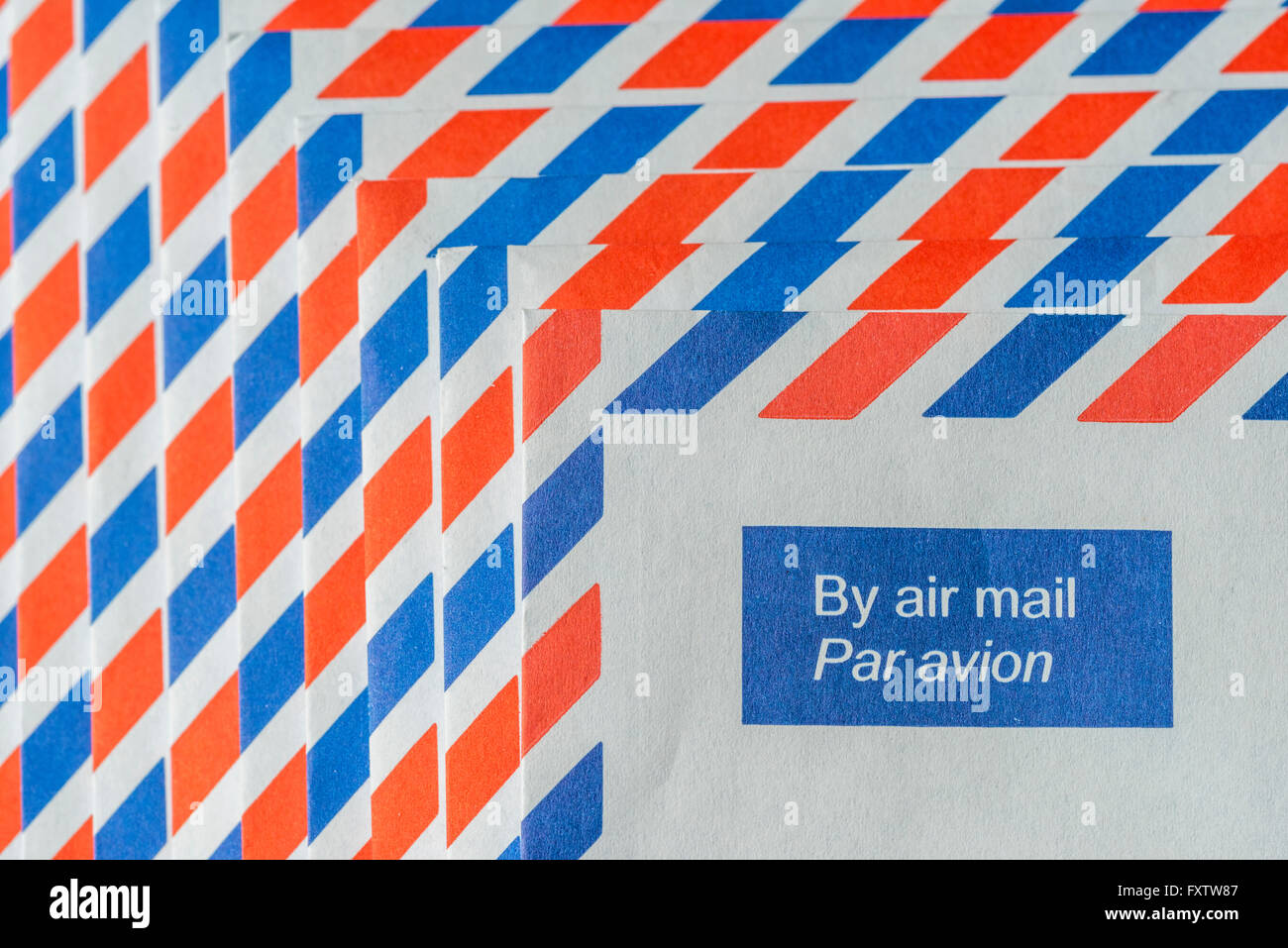 Distinct patterns of red, white and blue of stacked air mail envelopes ...