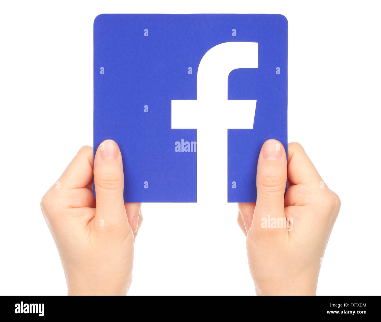 Kiev, Ukraine - January 15, 2016: Hands hold facebook logo printed on ...