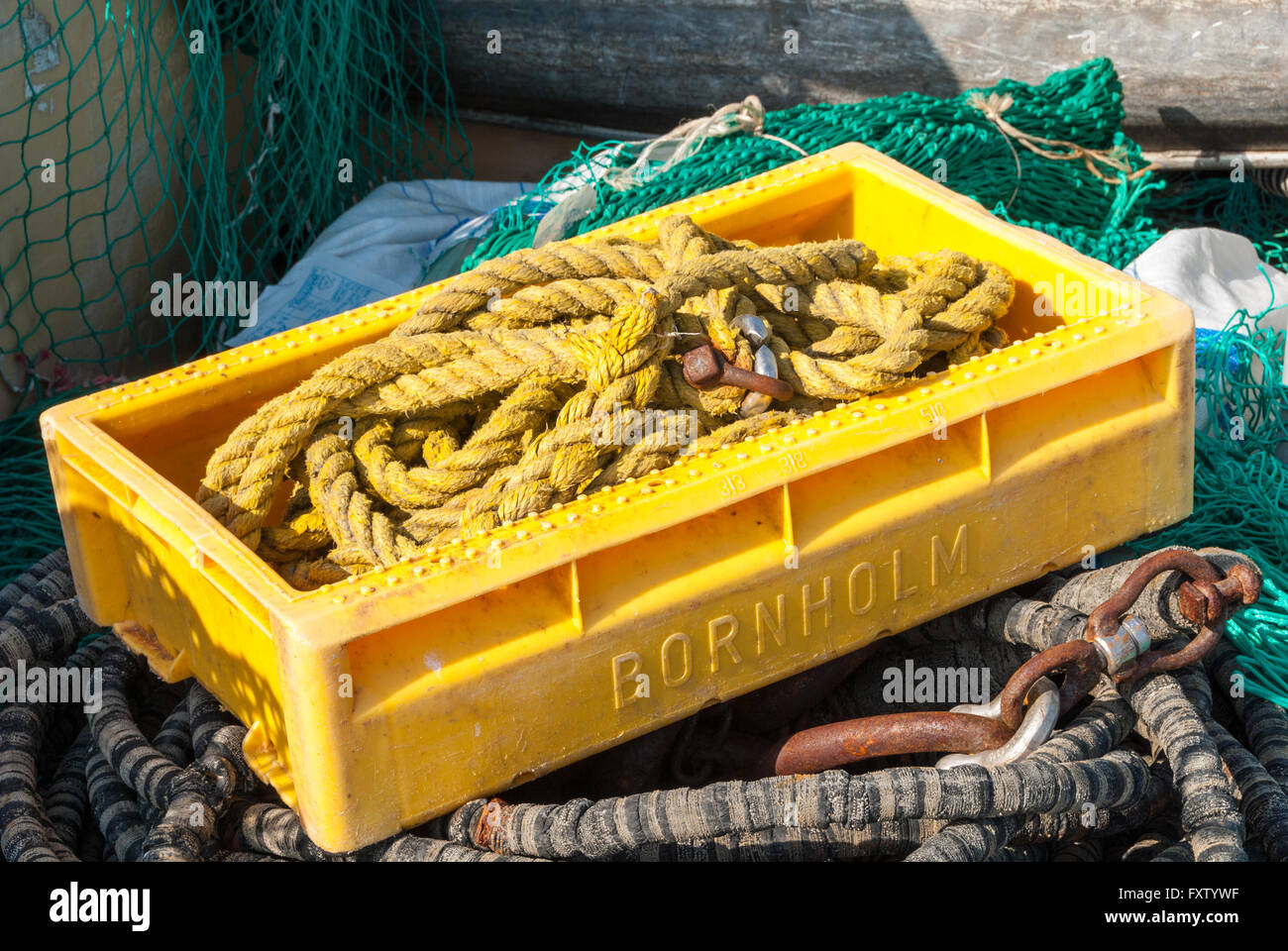 Fishing net and box with a rope in fishing port Maasholm Stock Photo ...