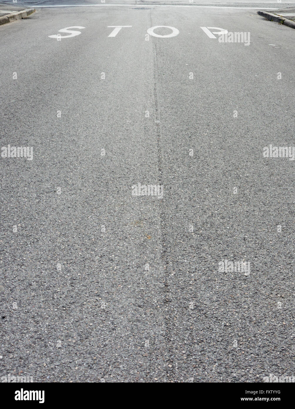 Stop sign written on the road hi-res stock photography and images - Alamy