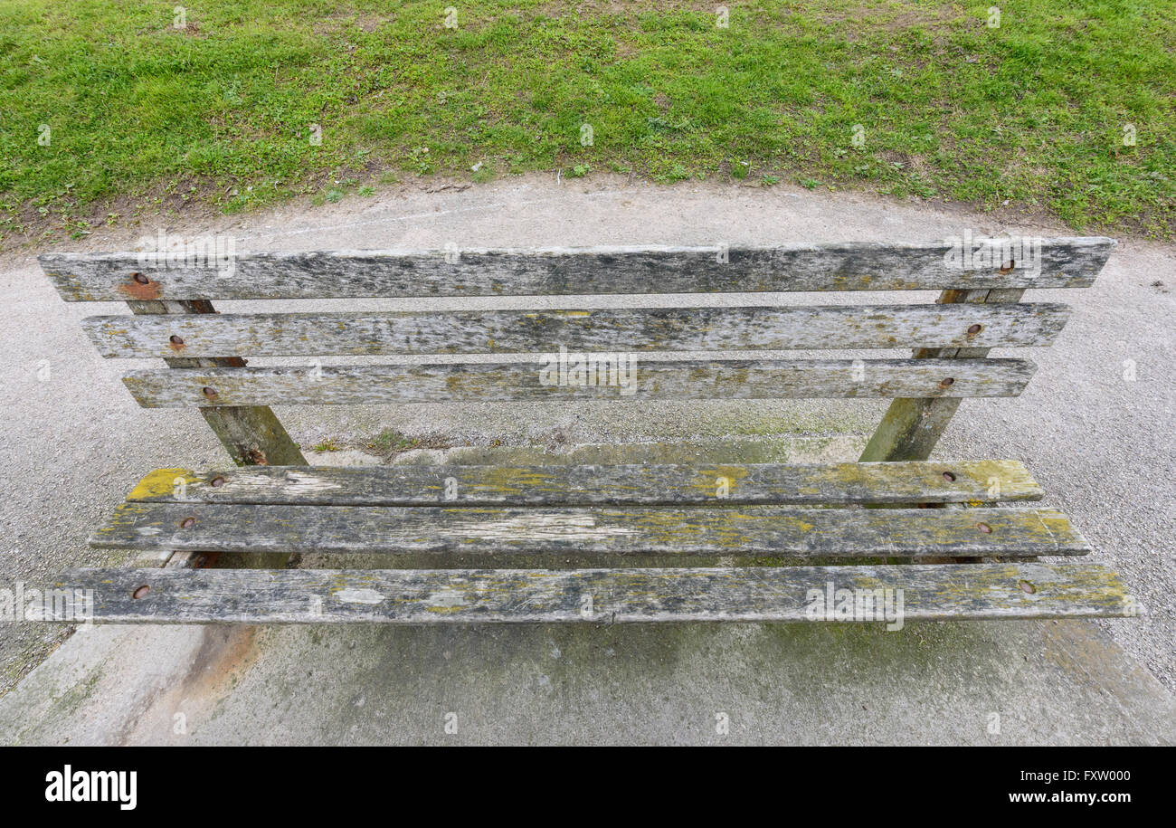 Old wooden lichen covered bench on the seafront in Blackpool ...