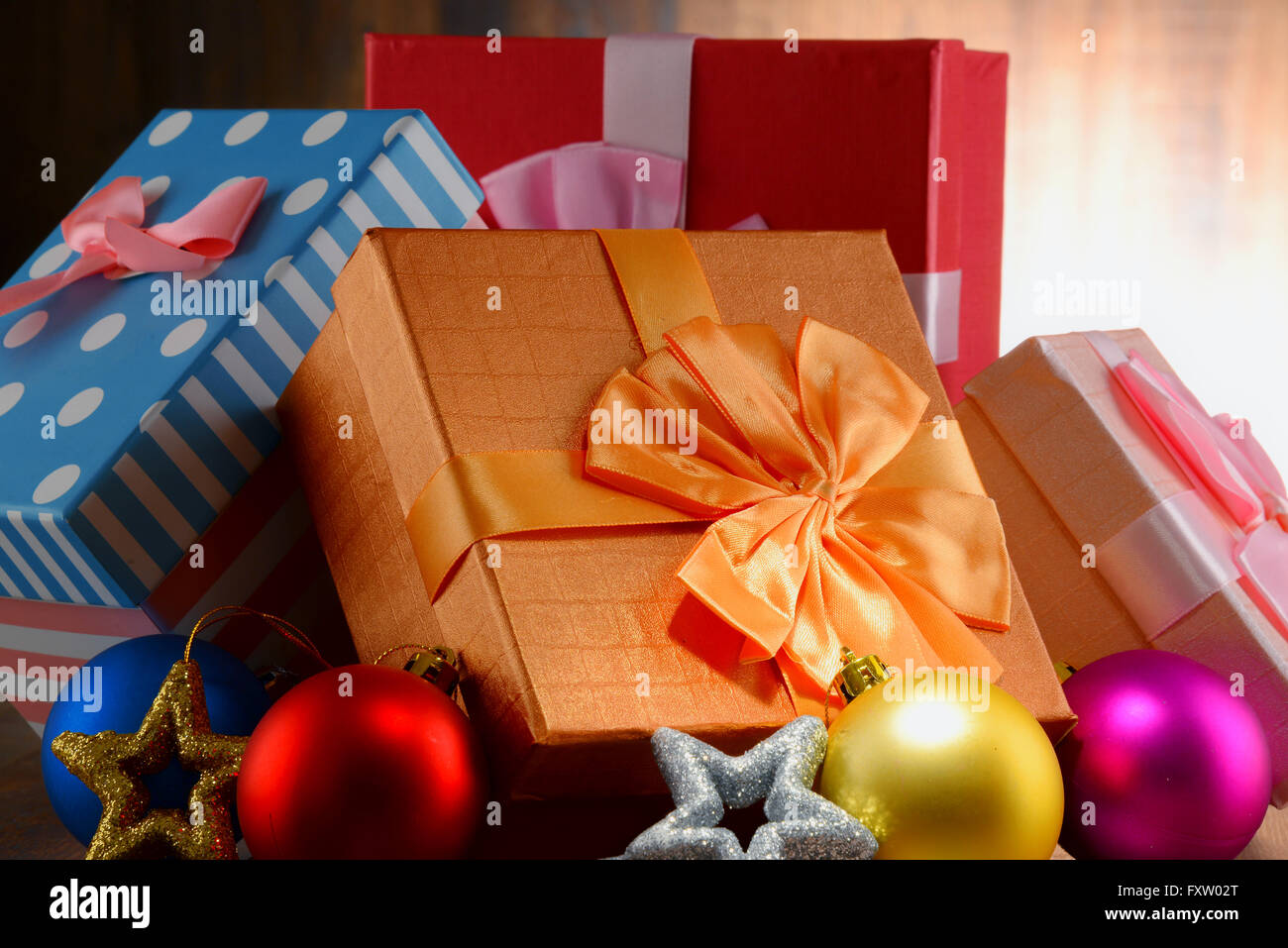 Colorful gift boxes and glass balls Stock Photo - Alamy